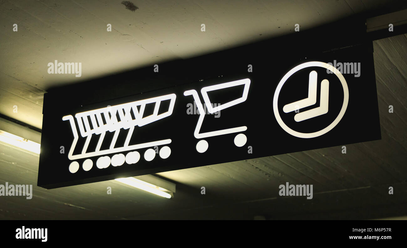 illuminated signs that indicate the direction of caddies in a basement ...