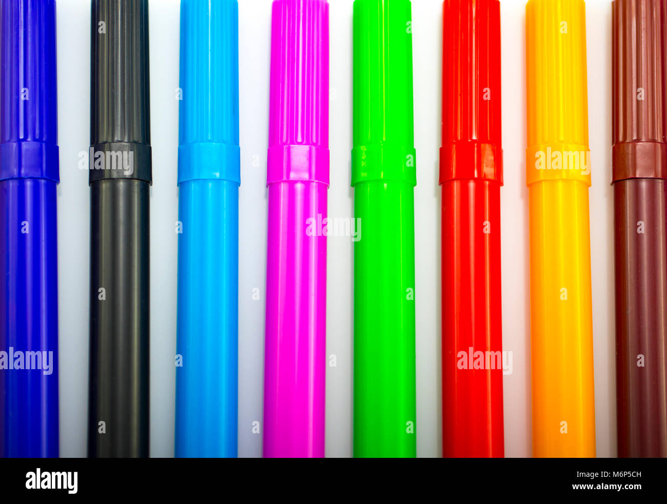 Colorful markers in a row, isolated on a white background Stock Photo ...