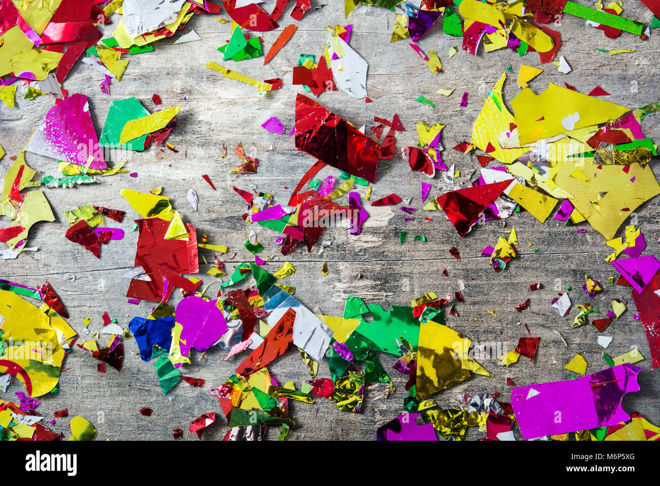 Colorful confetti on wooden table. Party concept. Top view Stock Photo ...
