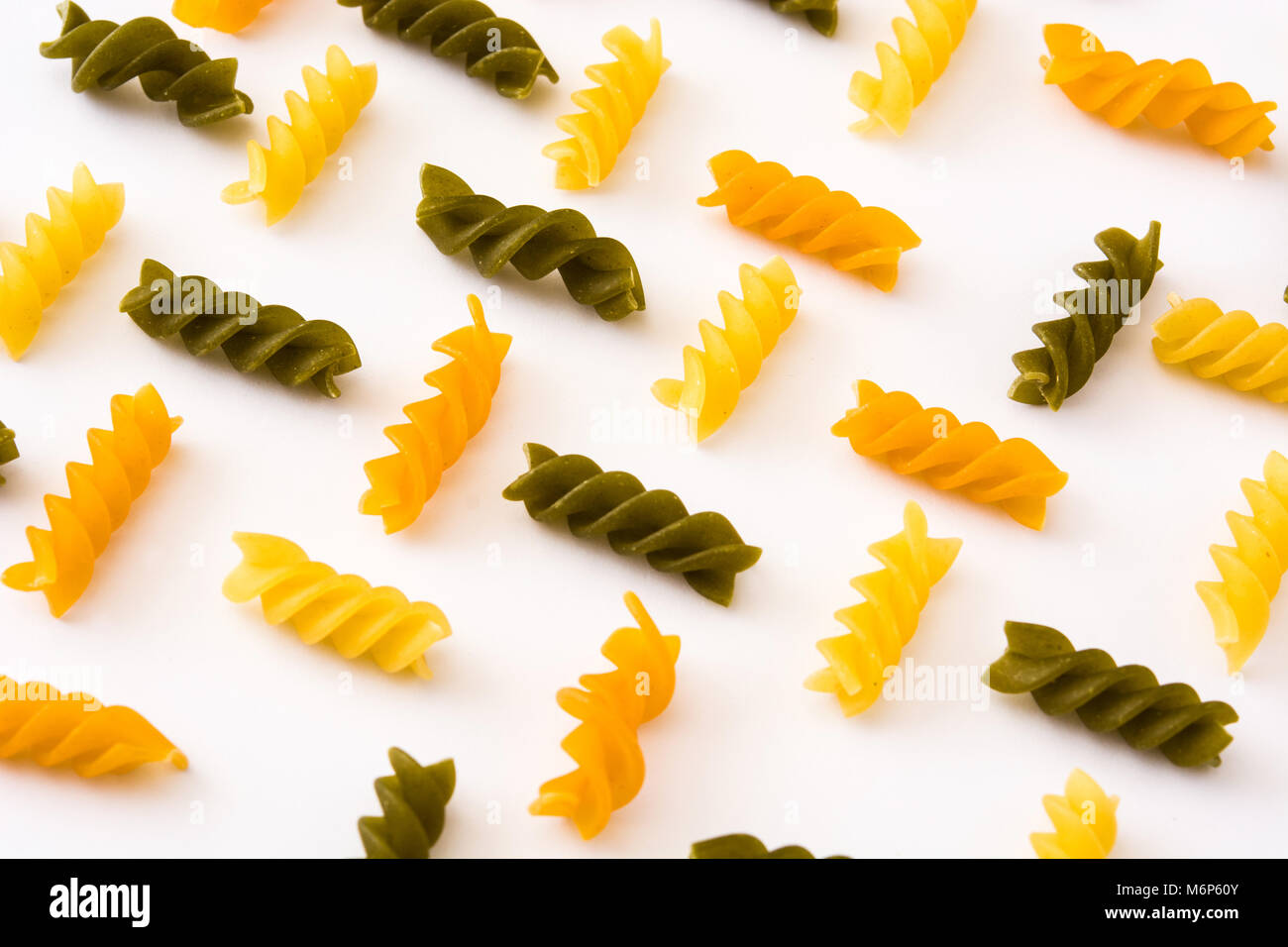 Colored pasta pattern on white background Stock Photo - Alamy