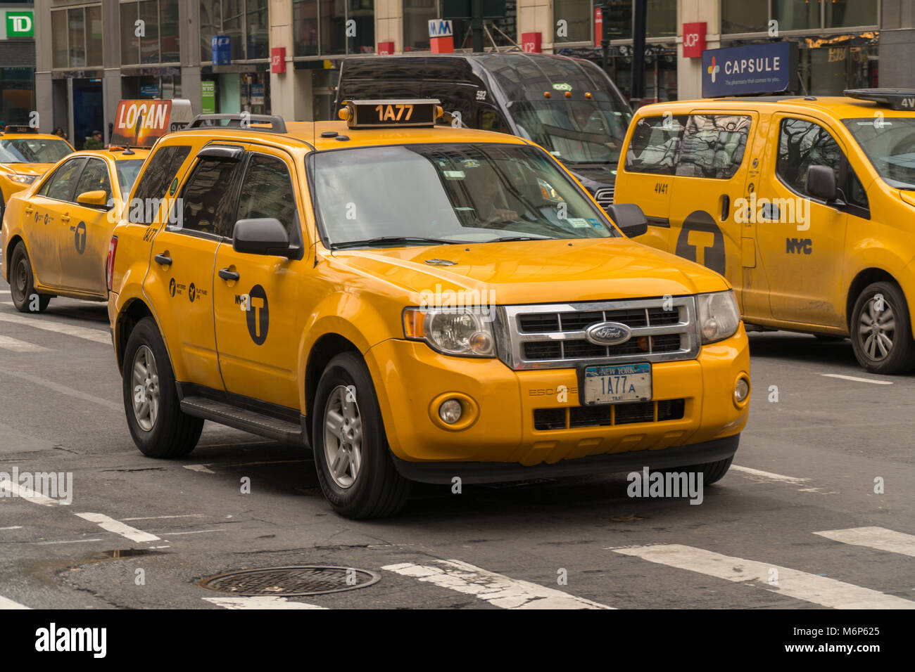New York City - Circa 2017: Yellow taxi cab driving in streets of ...