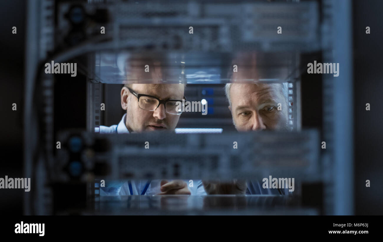 Two server engineers install hi-res stock photography and images - Alamy