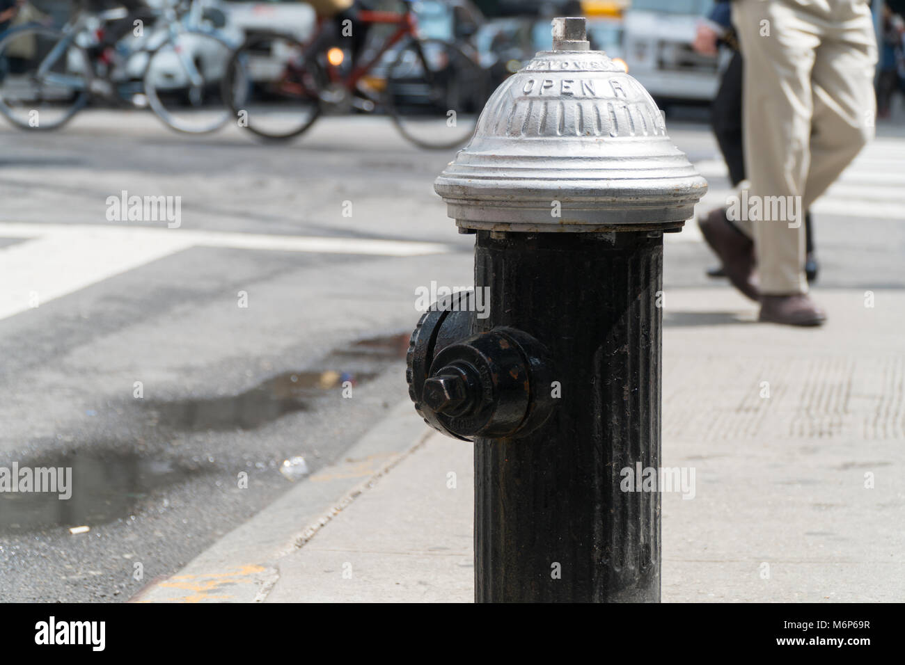 New York City fire hydrant on sidewalk corner of busy Manhattan ...