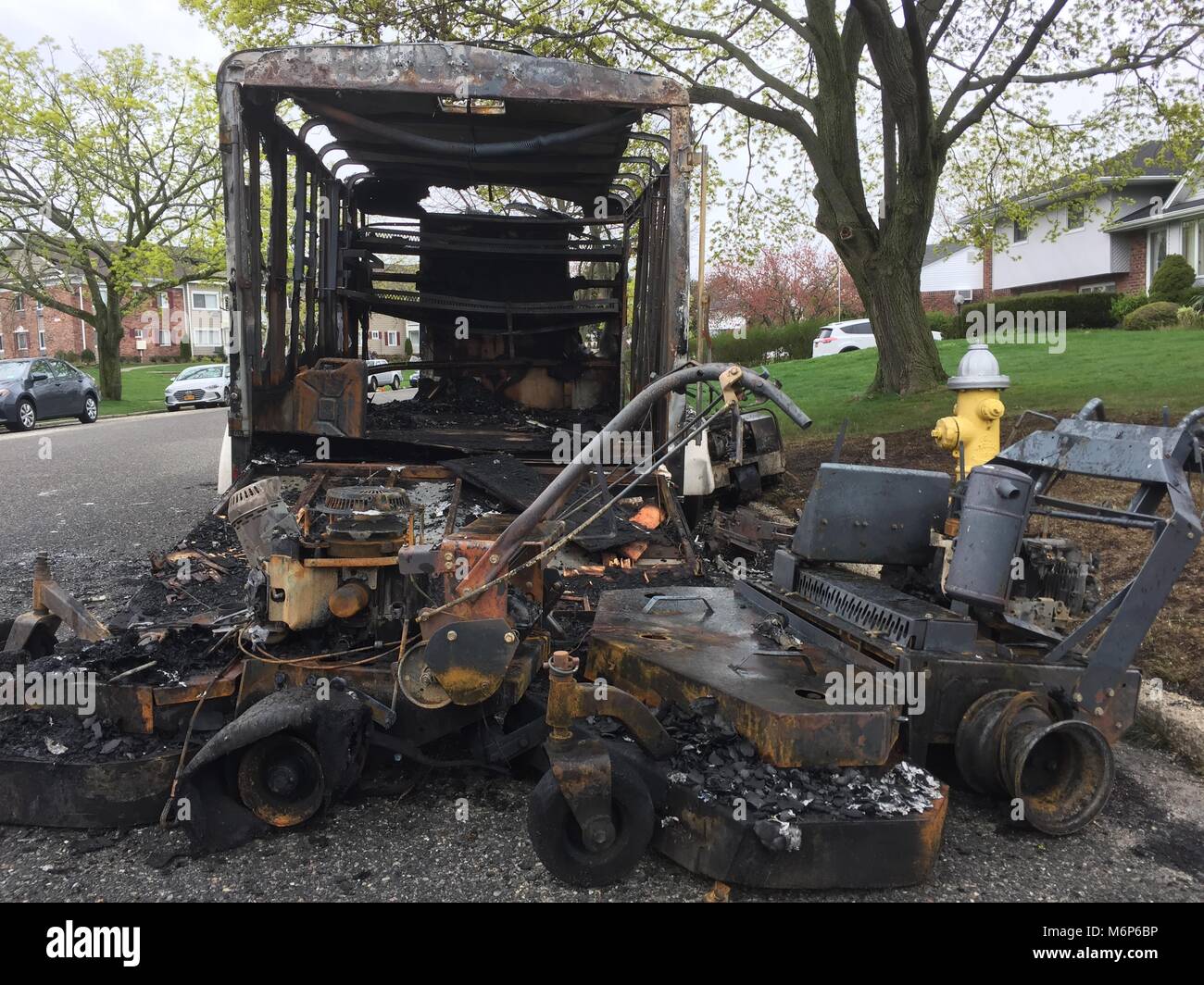 Landscaping truck fire aftermath as burned lawn mowers and equipment ...
