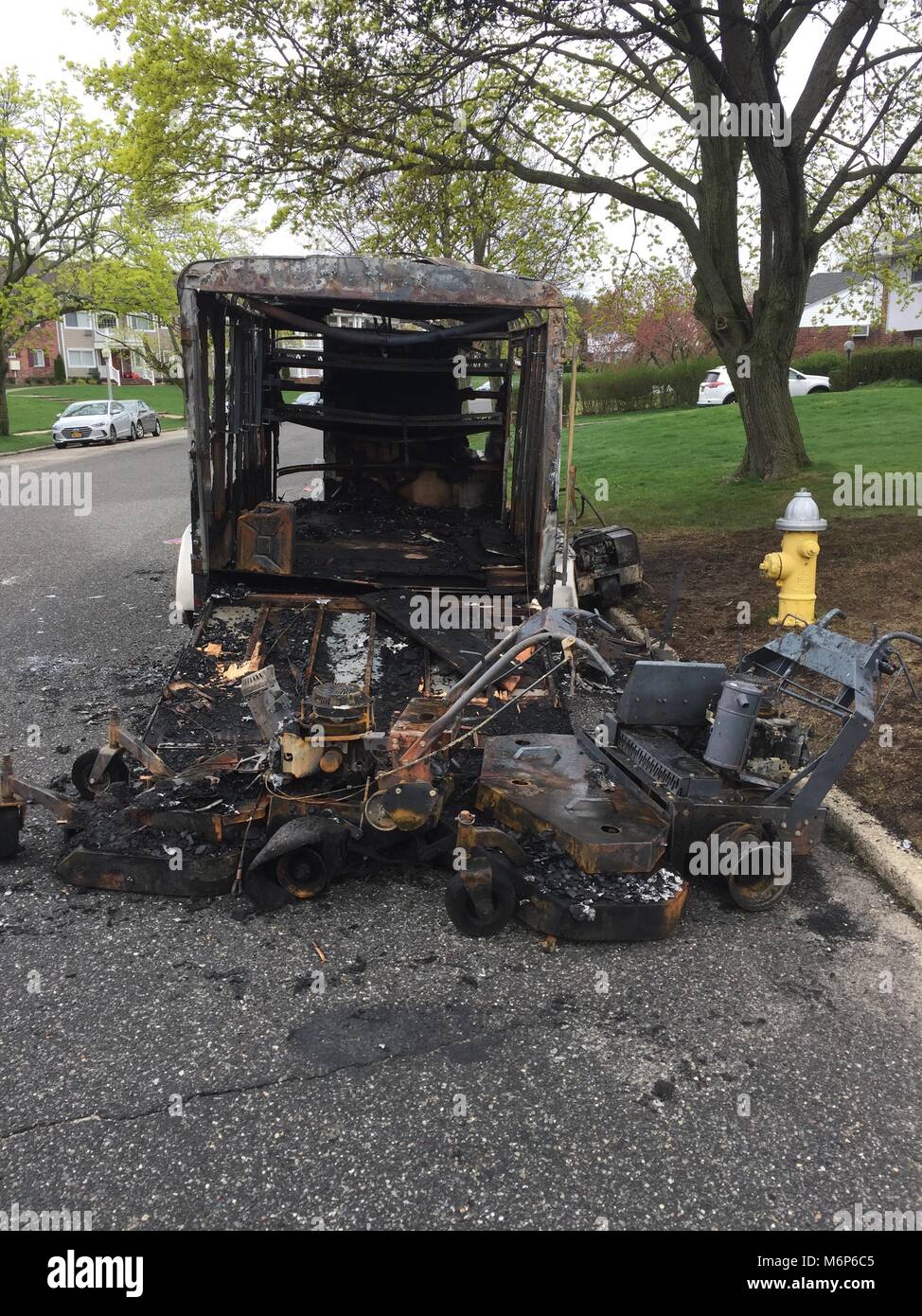 Landscaping truck fire aftermath. Lawn mower grass cutting equipment ...
