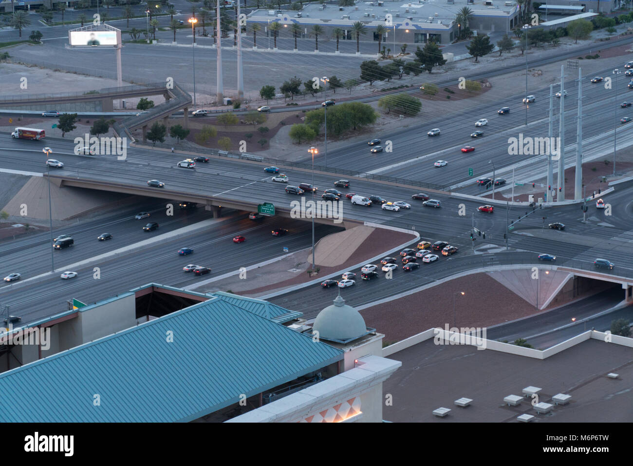 Aerial view overhead busy highway overpass intersection at sunset night ...