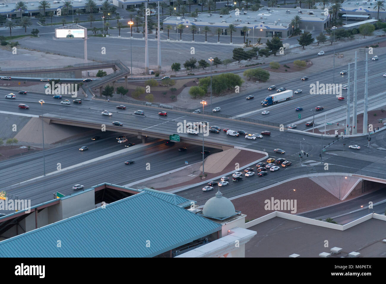 Aerial view overhead busy highway overpass intersection at sunset night ...