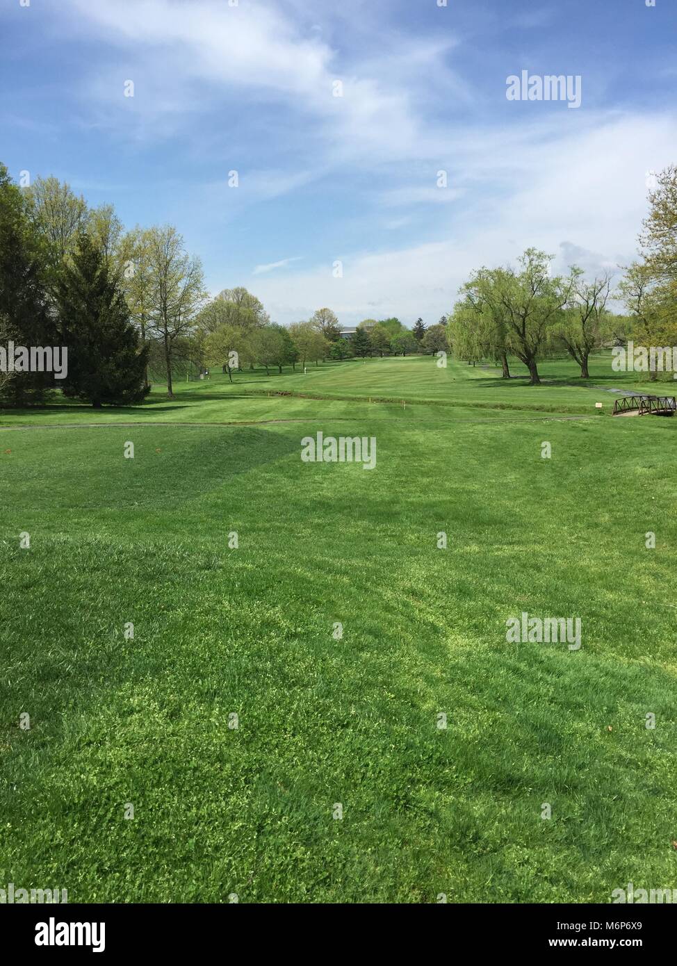 Beautiful view looking down the fairway of a public golf course on a ...