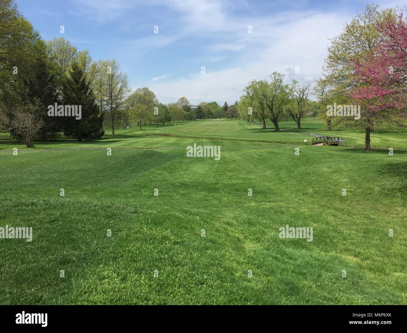 Beautiful view looking down the fairway of a public golf course on a ...
