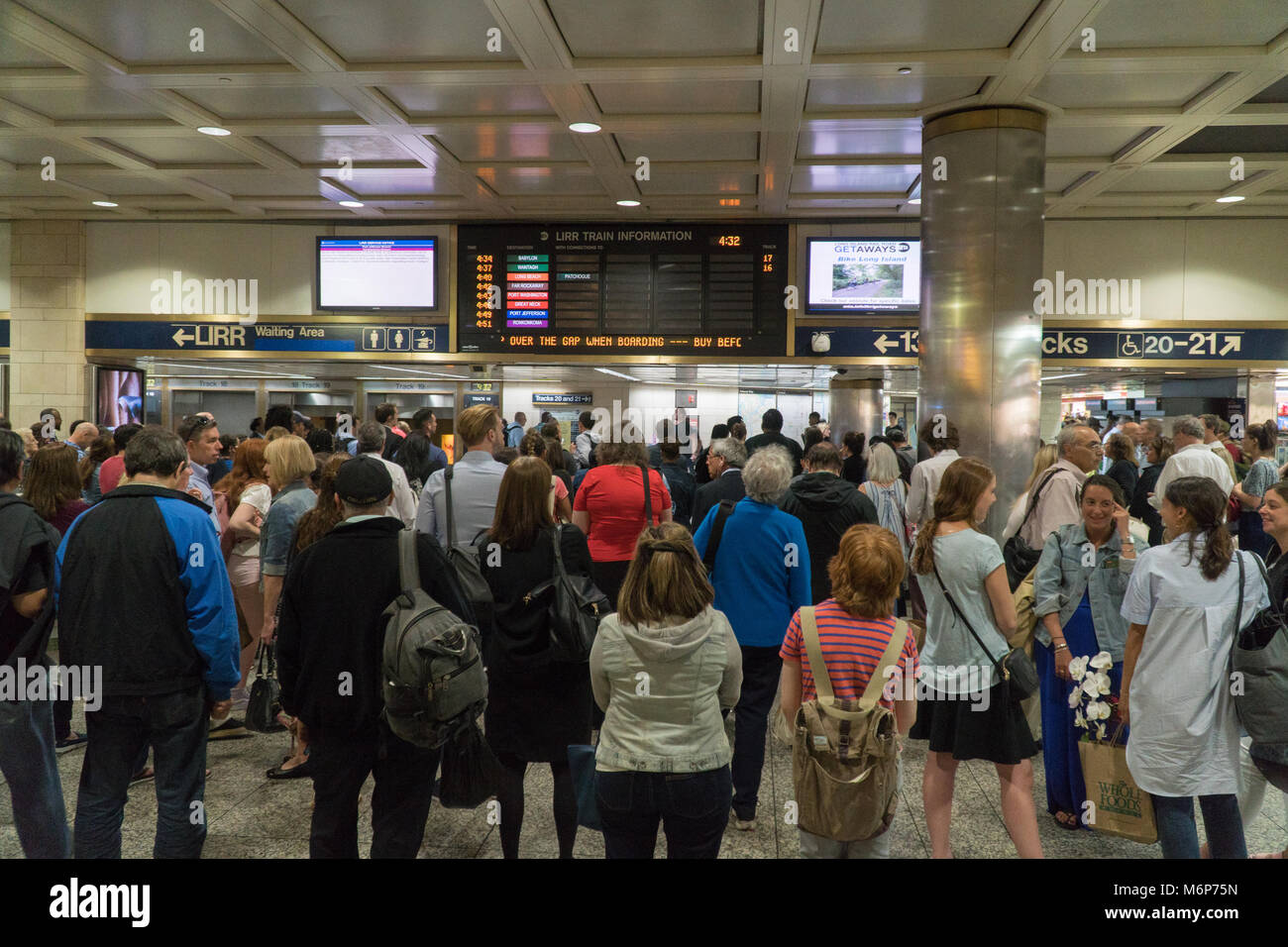 New York City, Circa 2017: Penn Station waiting area. Travelers view ...