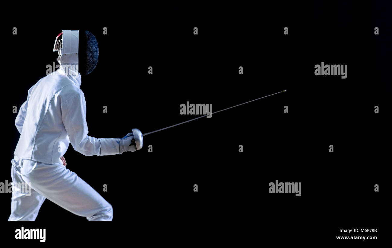 Side View of a Fully Equipped Skilled Fencer Training His Attack and ...