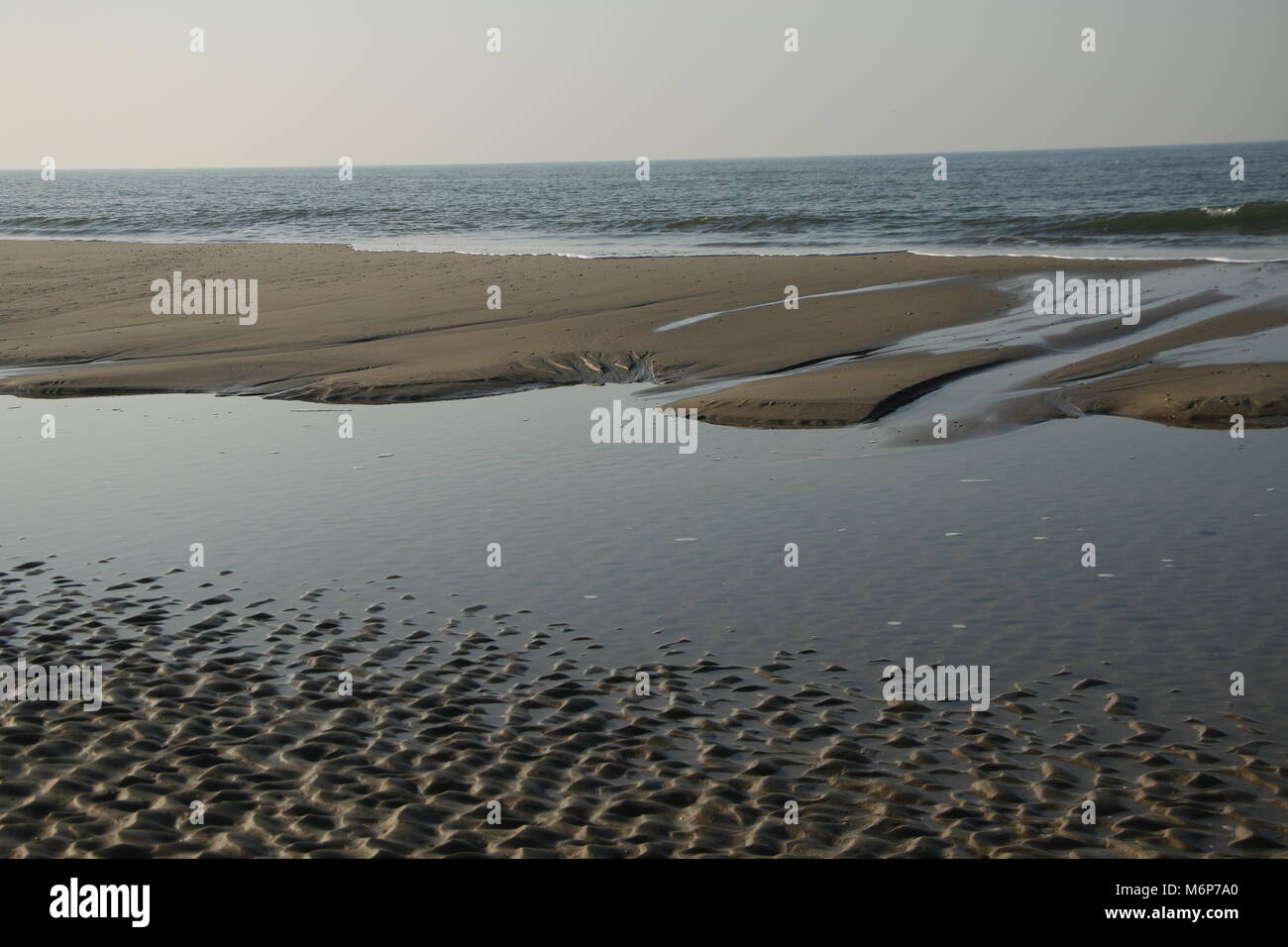 Low tide at the beach Stock Photo - Alamy