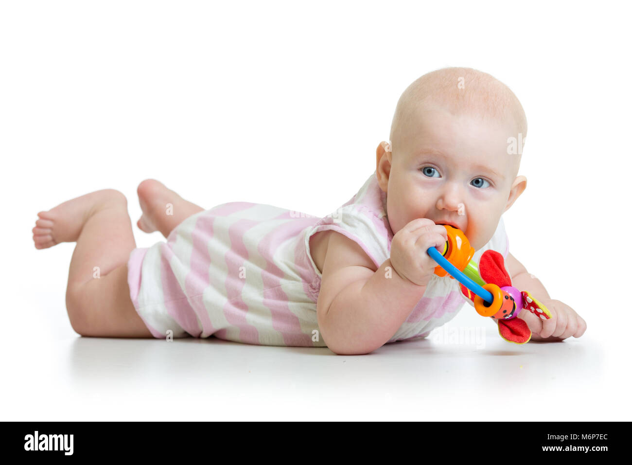 adorable baby girl teething and chewing teethers, isolated Stock Photo ...
