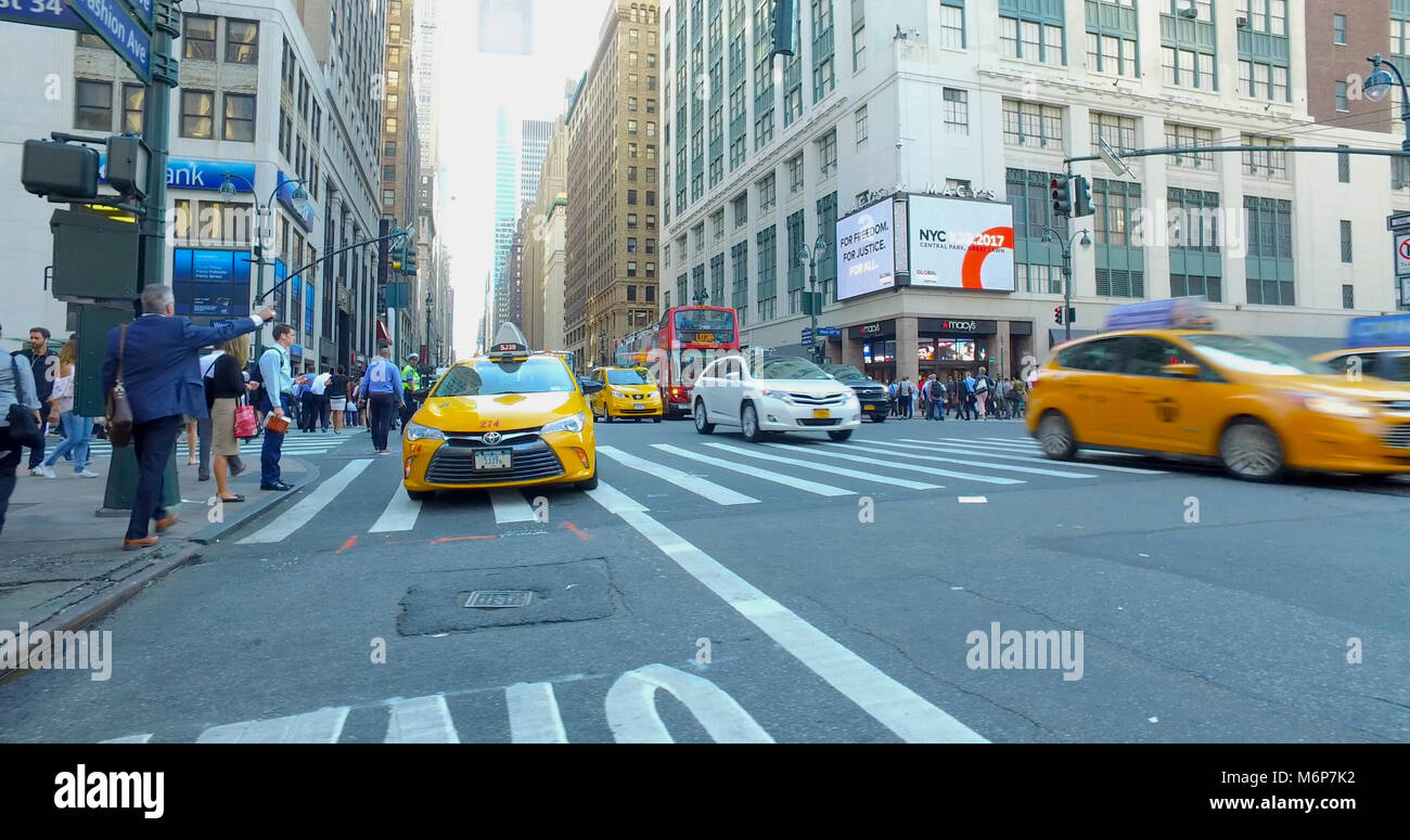 New York City, Circa 2017: Businessman hail yellow taxi cab during ...