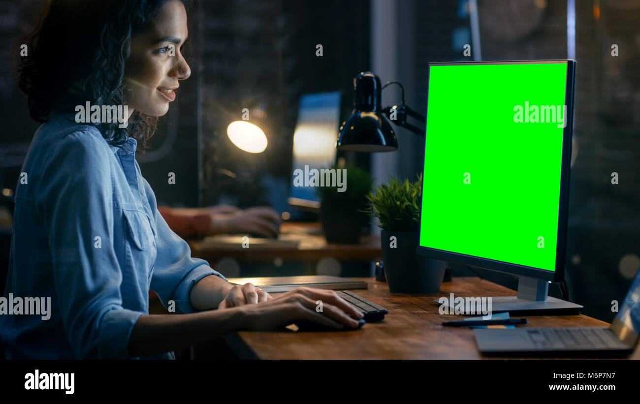 Beautiful Female Office Employee at Her Desk Works on a Mock-up Green ...
