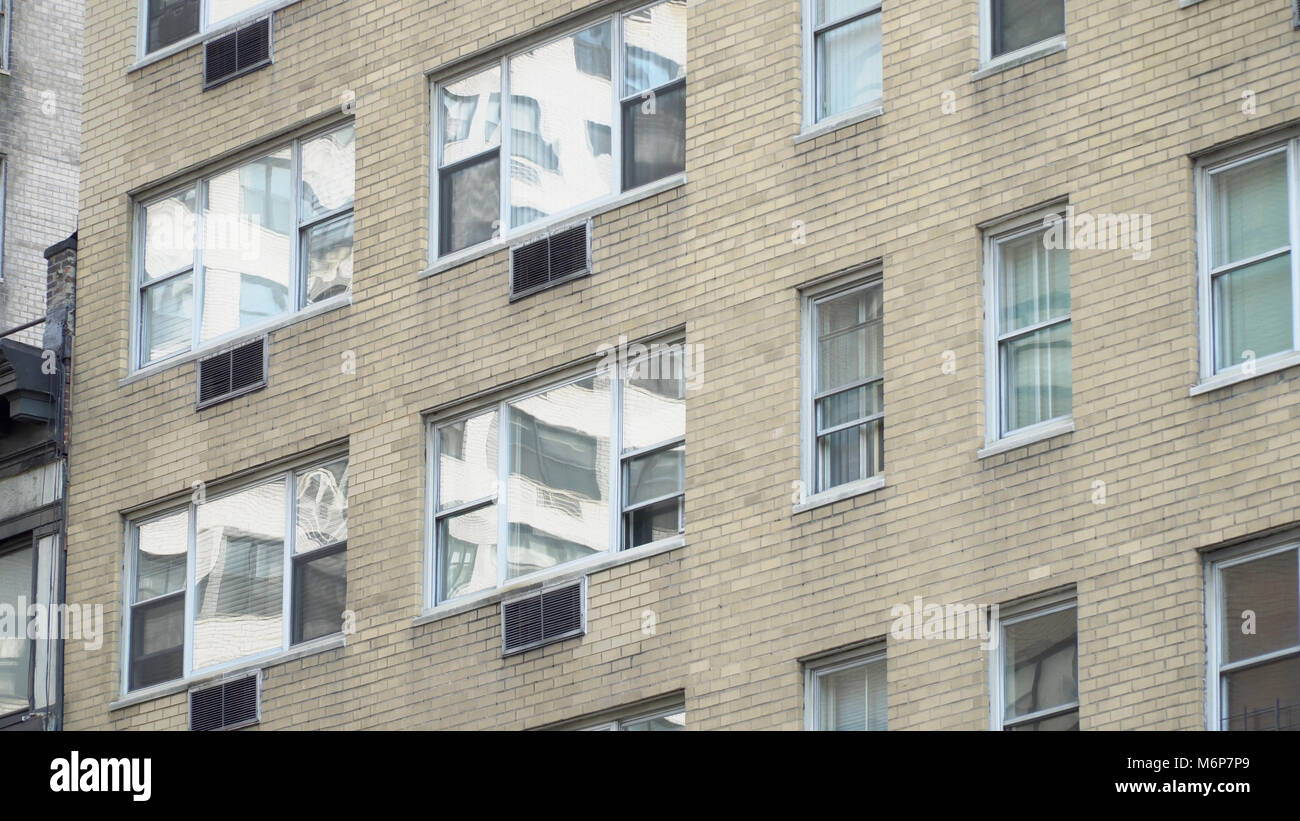 Standard urban city brick apartment or dorm style building exterior ...