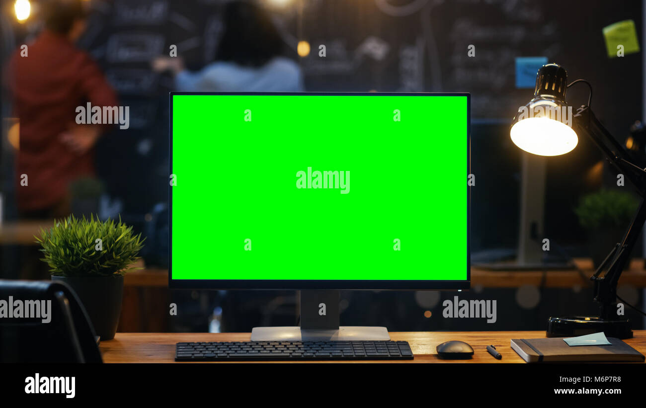 Personal Computer with Mock-up Green Screen Monitor Stands on the ...