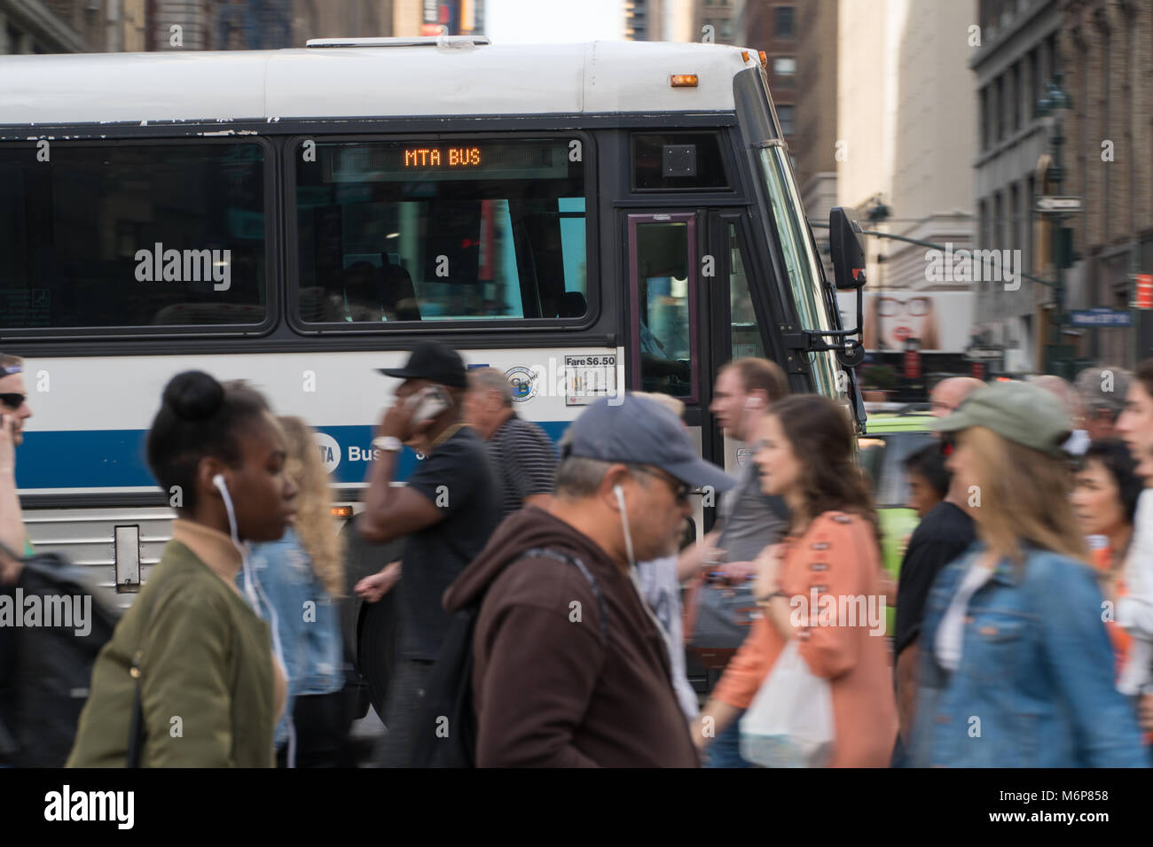 New York City, Circa 2017: MTA bus drive on street in Manhattan past ...
