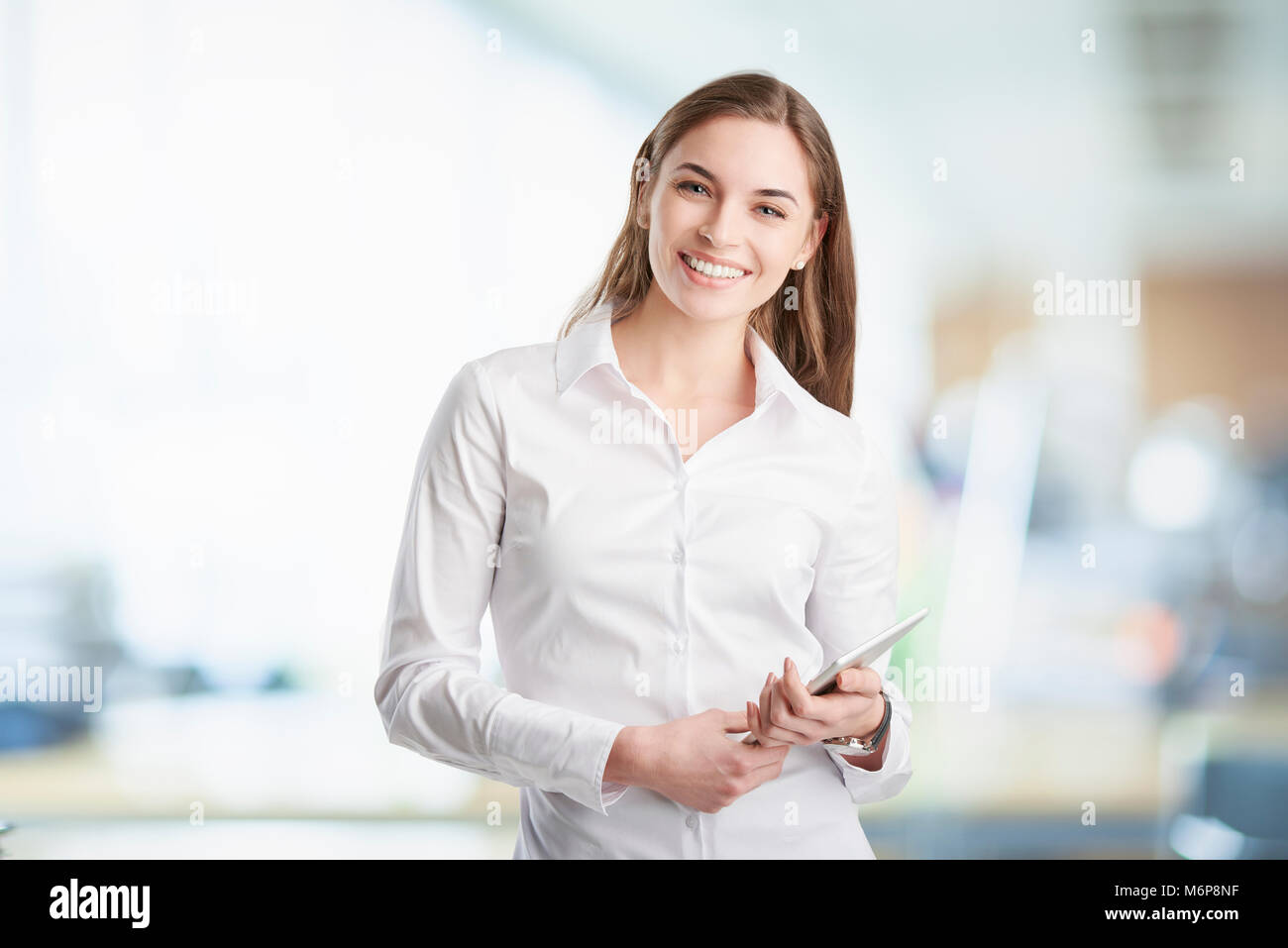 Portrait female sales assistant using hi-res stock photography and ...