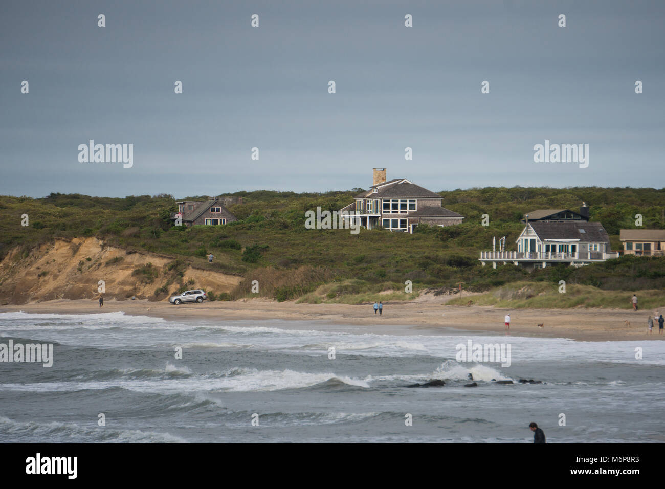 Wide exterior view of beachfront luxury vacation homes along the ocean ...