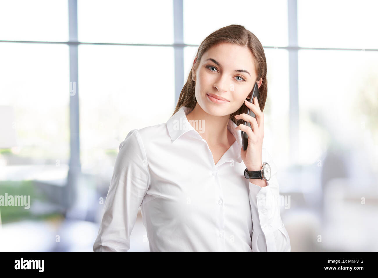 Attractive young financial assistant businesswoman talking with ...