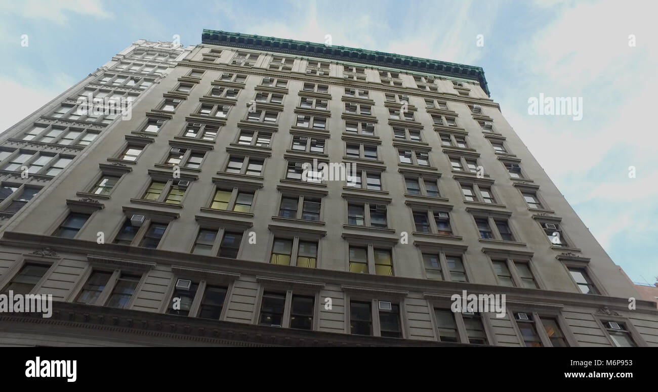 Vertical look up view of typical NYC style apartment office building ...