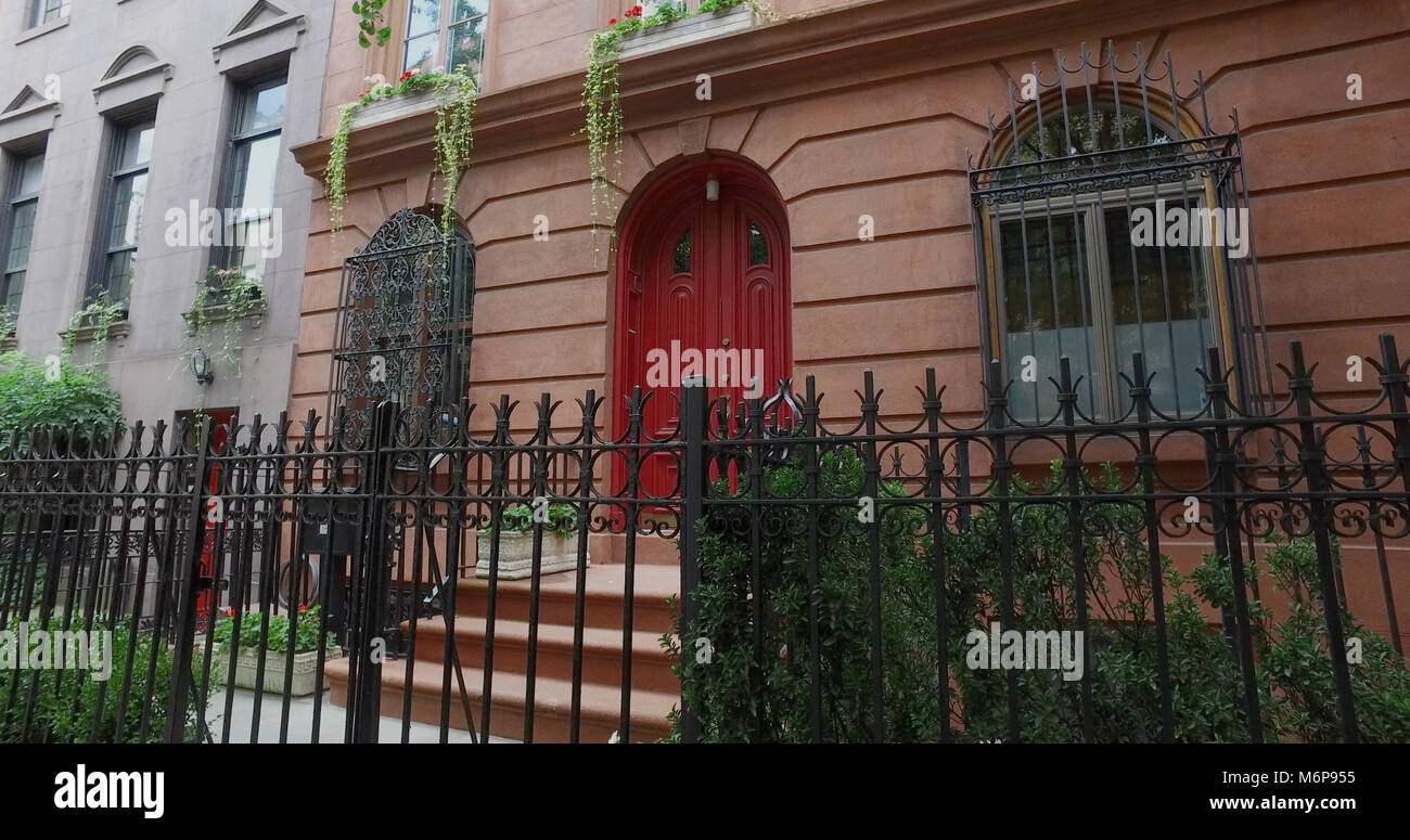 Generic urban city apartment building door exterior with steel fence ...