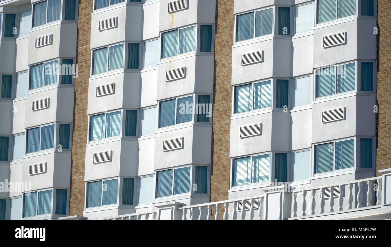 Establishing shot day time exterior close up hotel room window facade ...