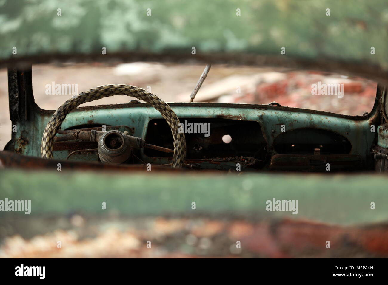 Steering wheel inside an old rusted car Stock Photo - Alamy