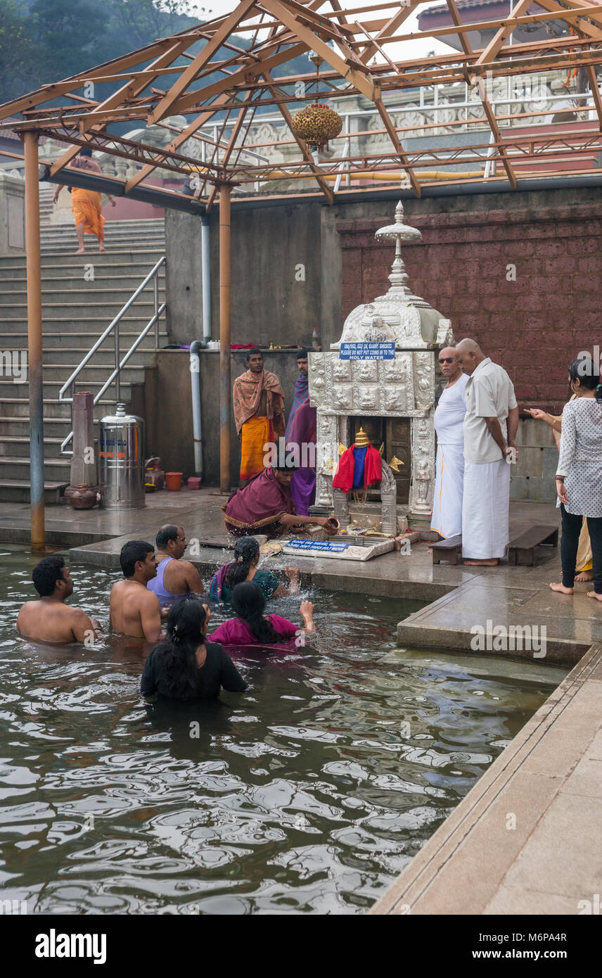 Talakaveri, India - October 31, 2013: People perform bathing ritual in ...