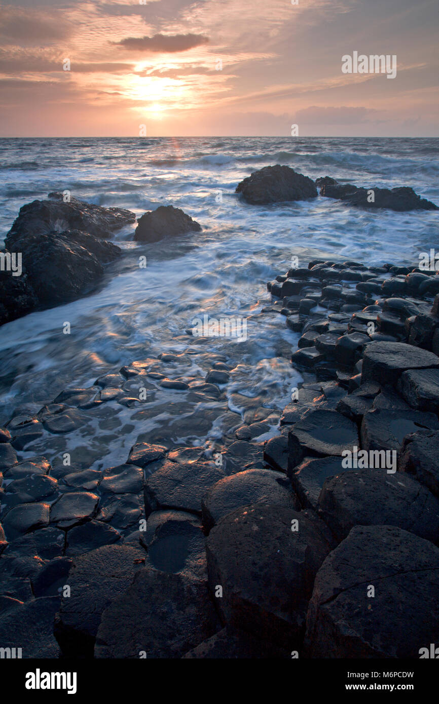 Hexagonal basalt rocks, Giant's Causeway, Northern Ireland at sunset ...