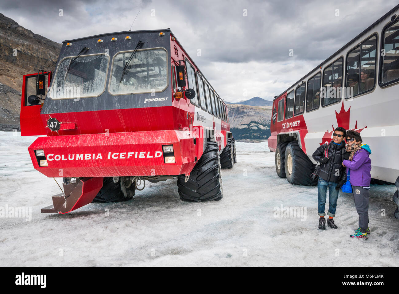 Visitors, snow coaches, at Athabasca Glacier, Jasper National Park ...