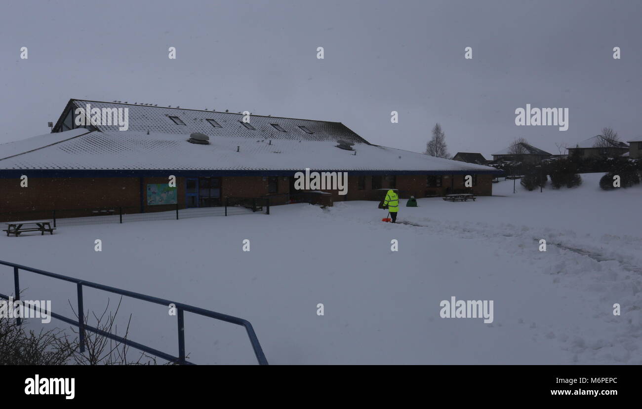 Man clearing path through snow to Birkhill Primary School Angus ...