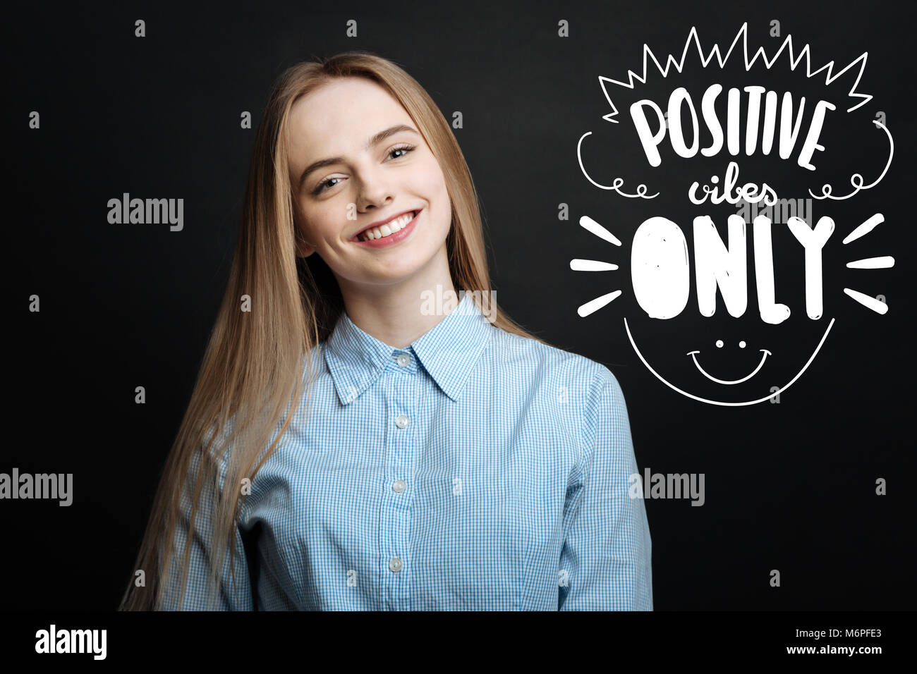 Cheerful beautiful student smiling and looking happy Stock Photo - Alamy