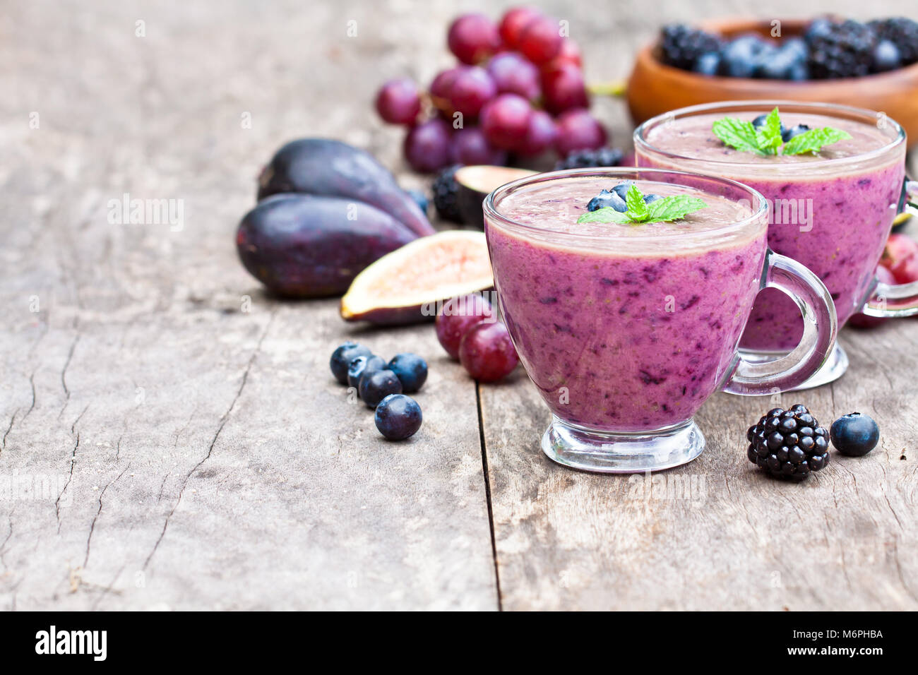 fresh healthy pulpy cocktail with purple fruits and berries Stock Photo ...