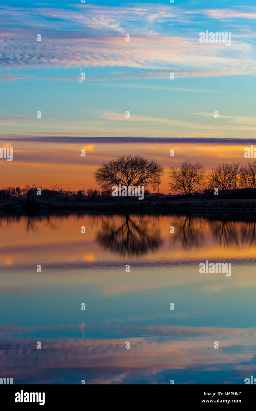 Vertical symmetry with beautiful sunset over lake Stock Photo - Alamy