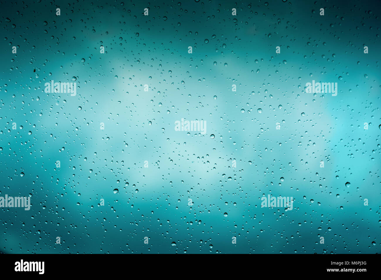Beautiful cover of gradient background. Rain drops on glass with dark ...