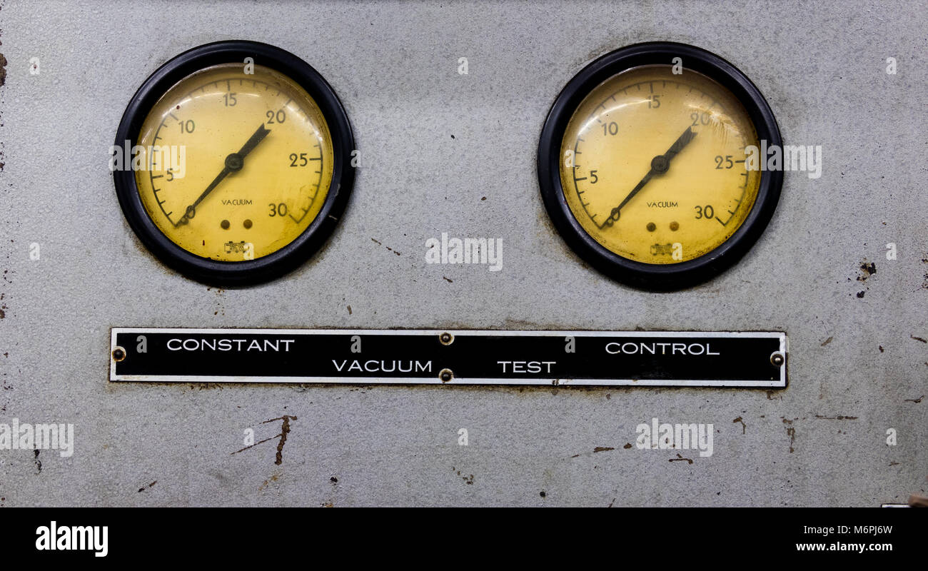 Vintage antique automotive machine shop vacuum gauges on a silver sheet ...