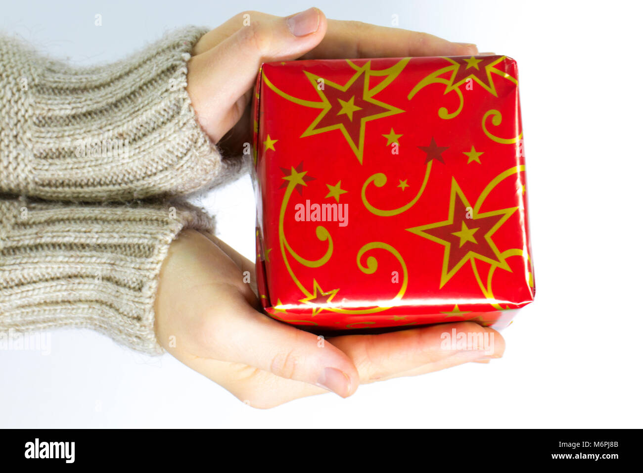 Female hands giving a Christmas gift isolated on white background Stock ...
