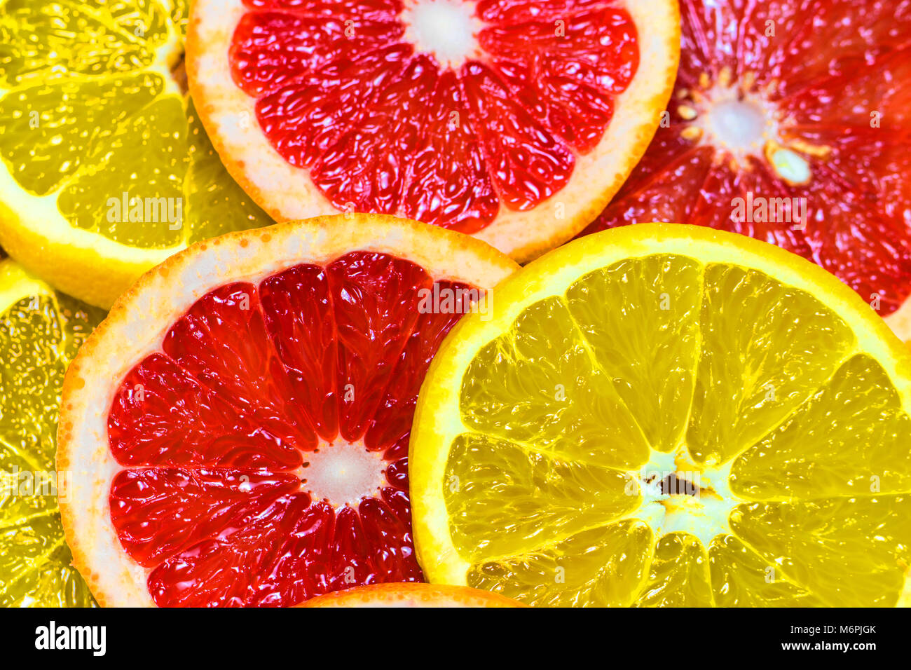 Juicy orange and grapefruit ring close-up as background Stock Photo - Alamy