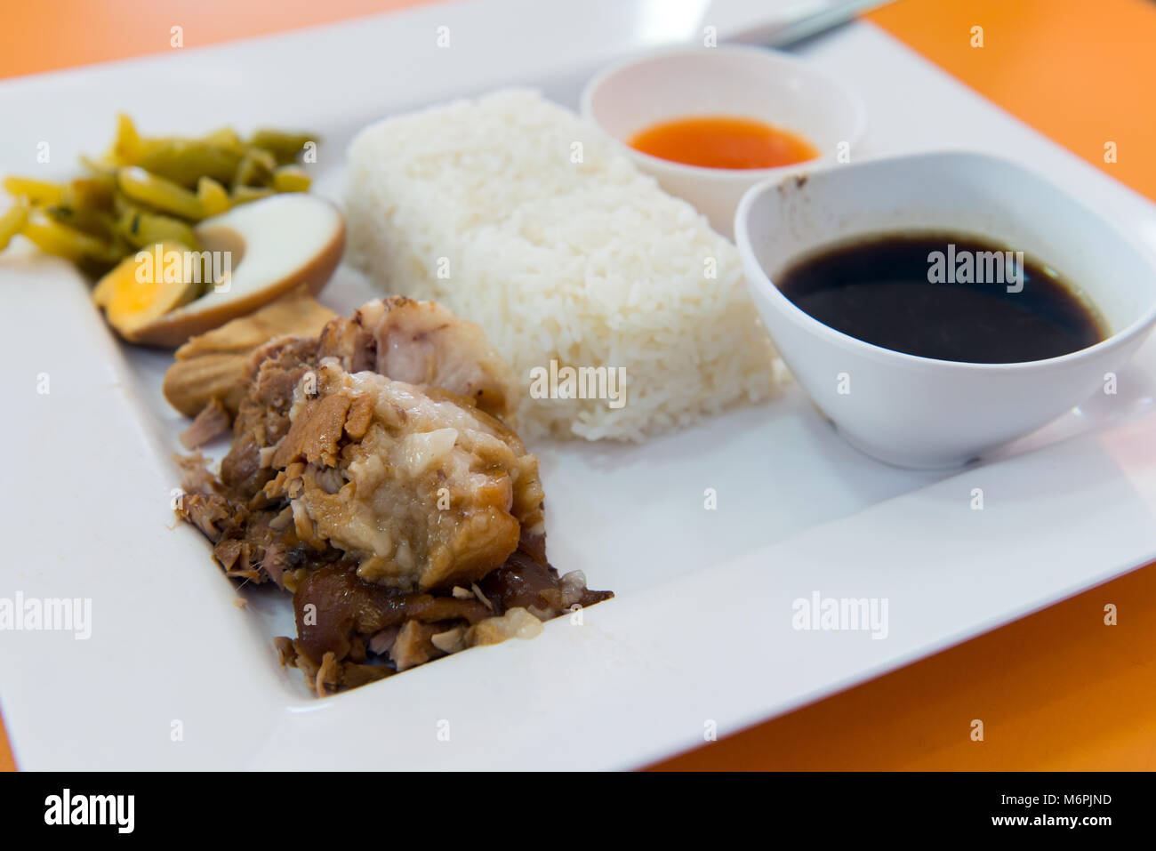 Famous Thai stewed pork leg rice Stock Photo - Alamy