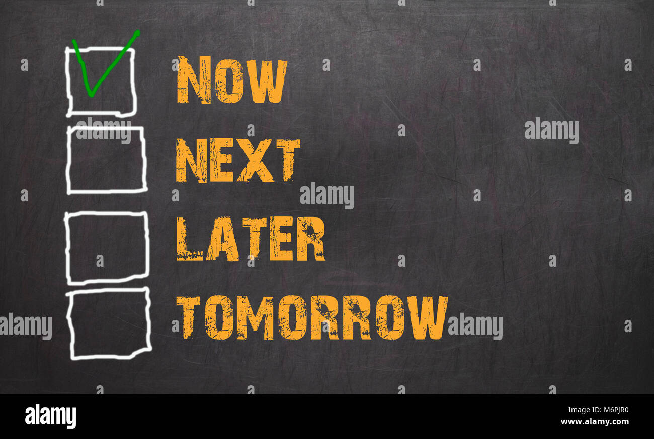 Do it now - business concept on blackboard background Stock Photo - Alamy