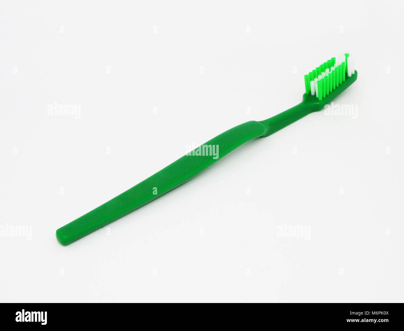 green tooth brush isolated on a white background Stock Photo - Alamy
