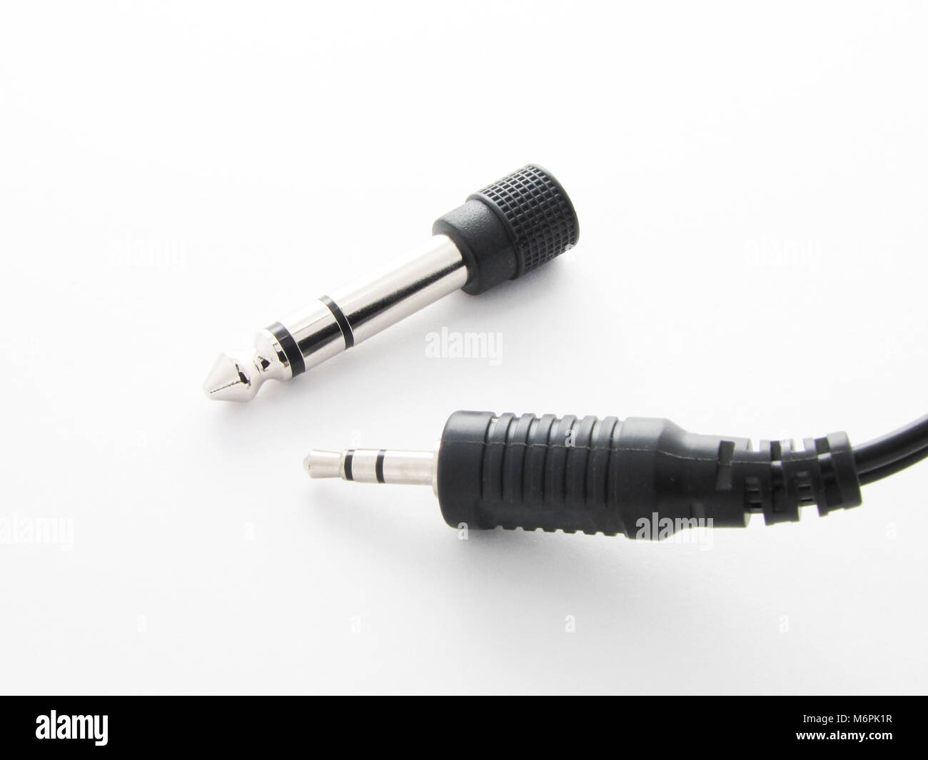 adapter for audio connection of different devices on a white background ...