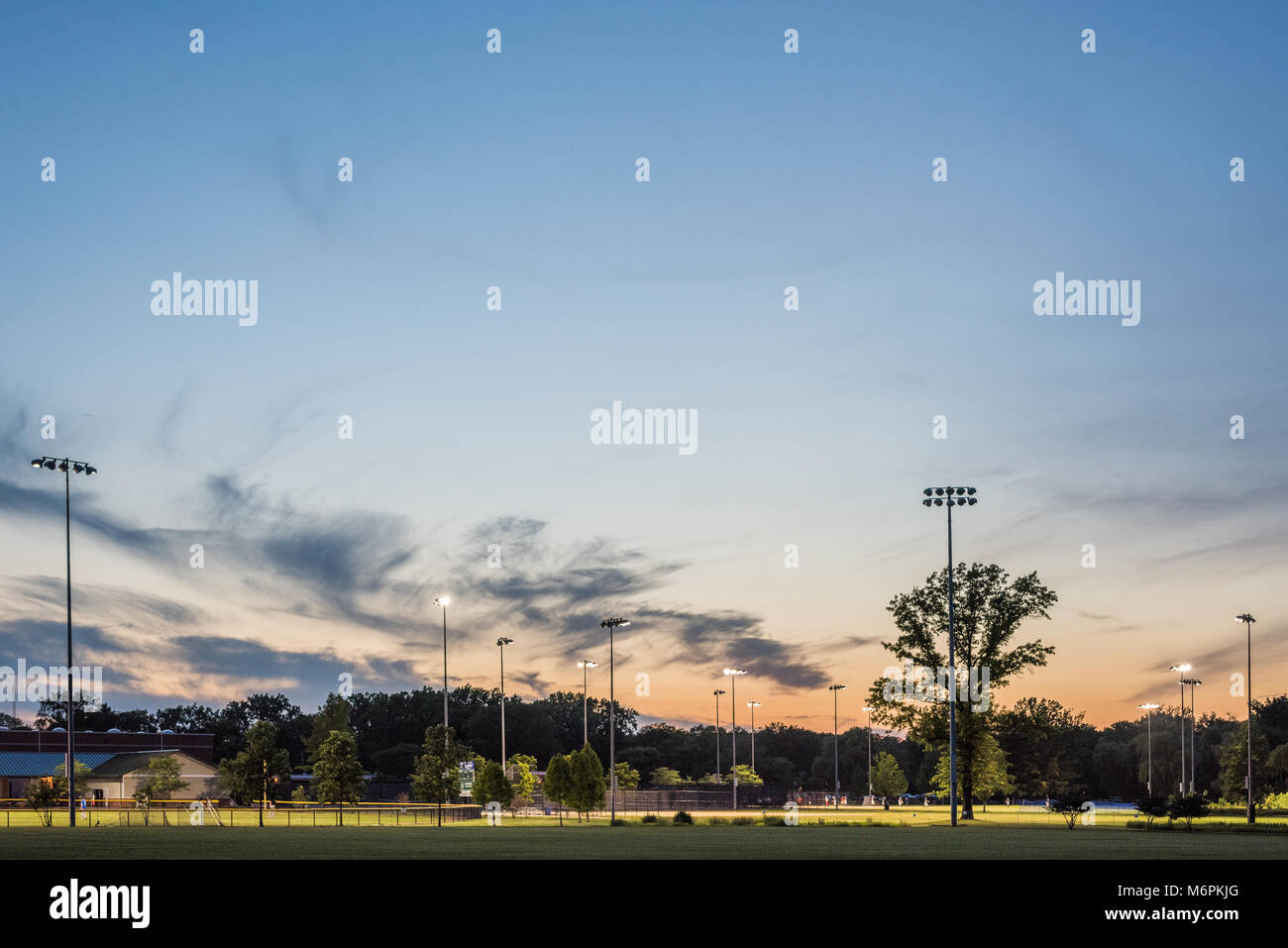 Suburban baseball field and park at sunset Stock Photo - Alamy