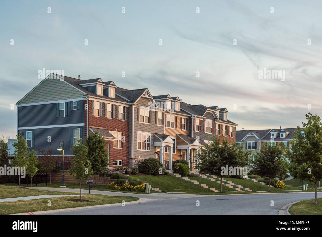 Suburban townhouses at dusk Stock Photo - Alamy