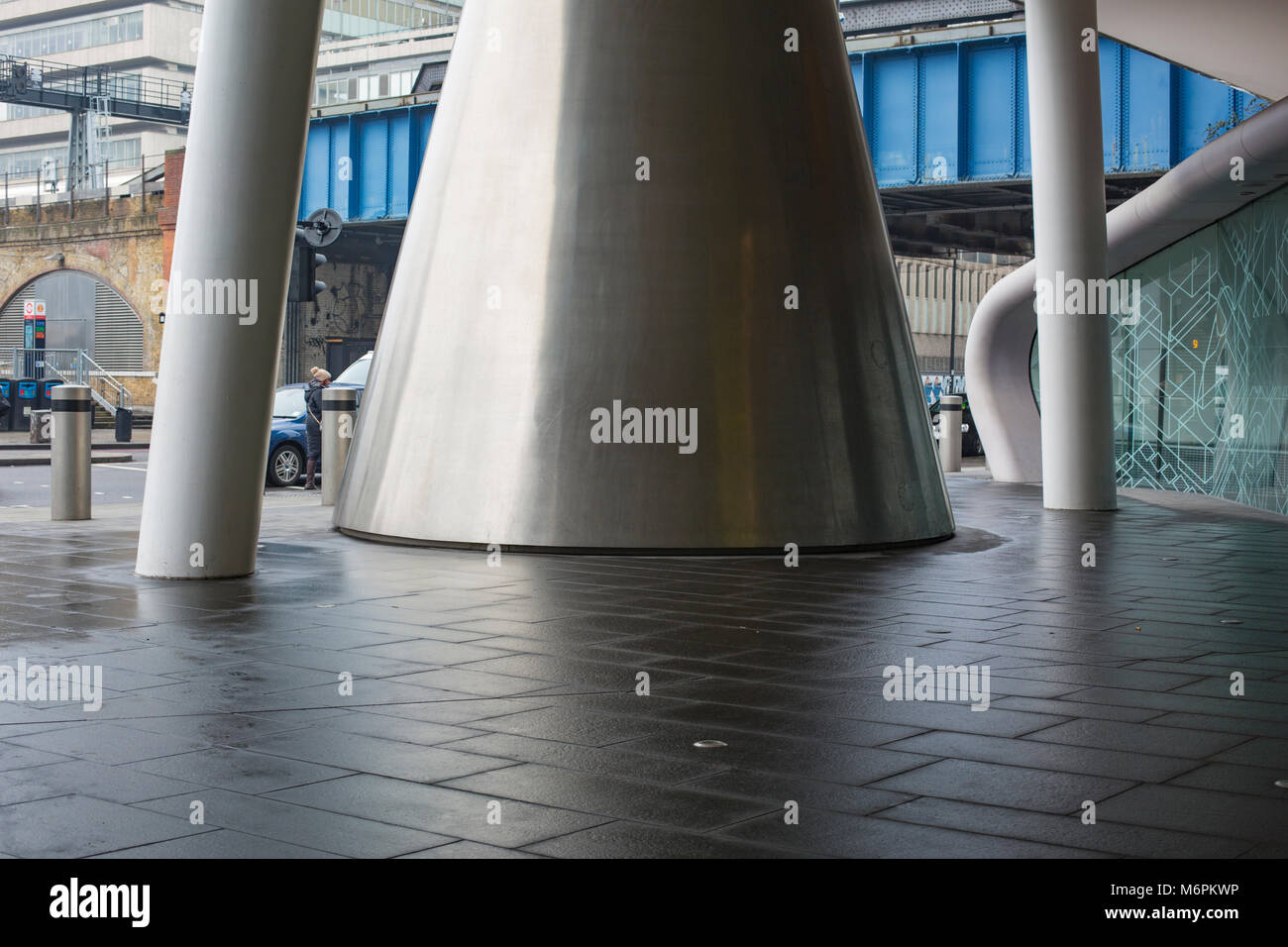 abstract architecture of steel cone, pillars and decorative glass and a ...