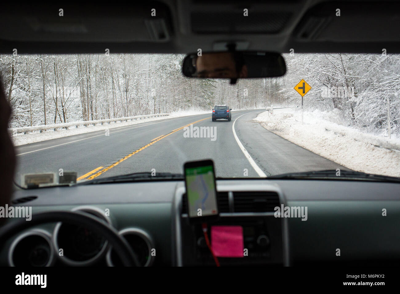 Winter car driving snowy road hard navigation Stock Photo - Alamy