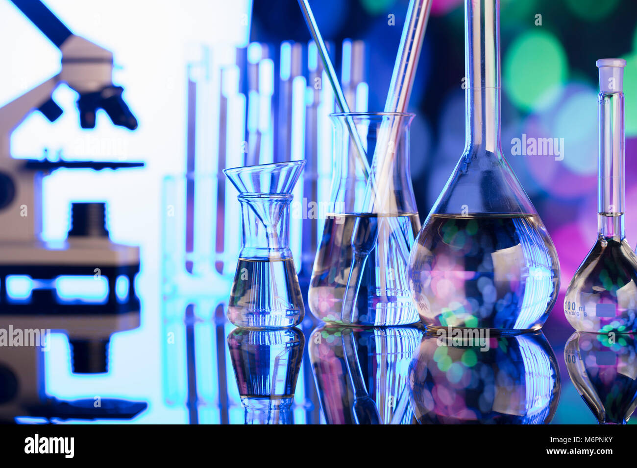 Science concept background. Microscope and laboratory glassware ...