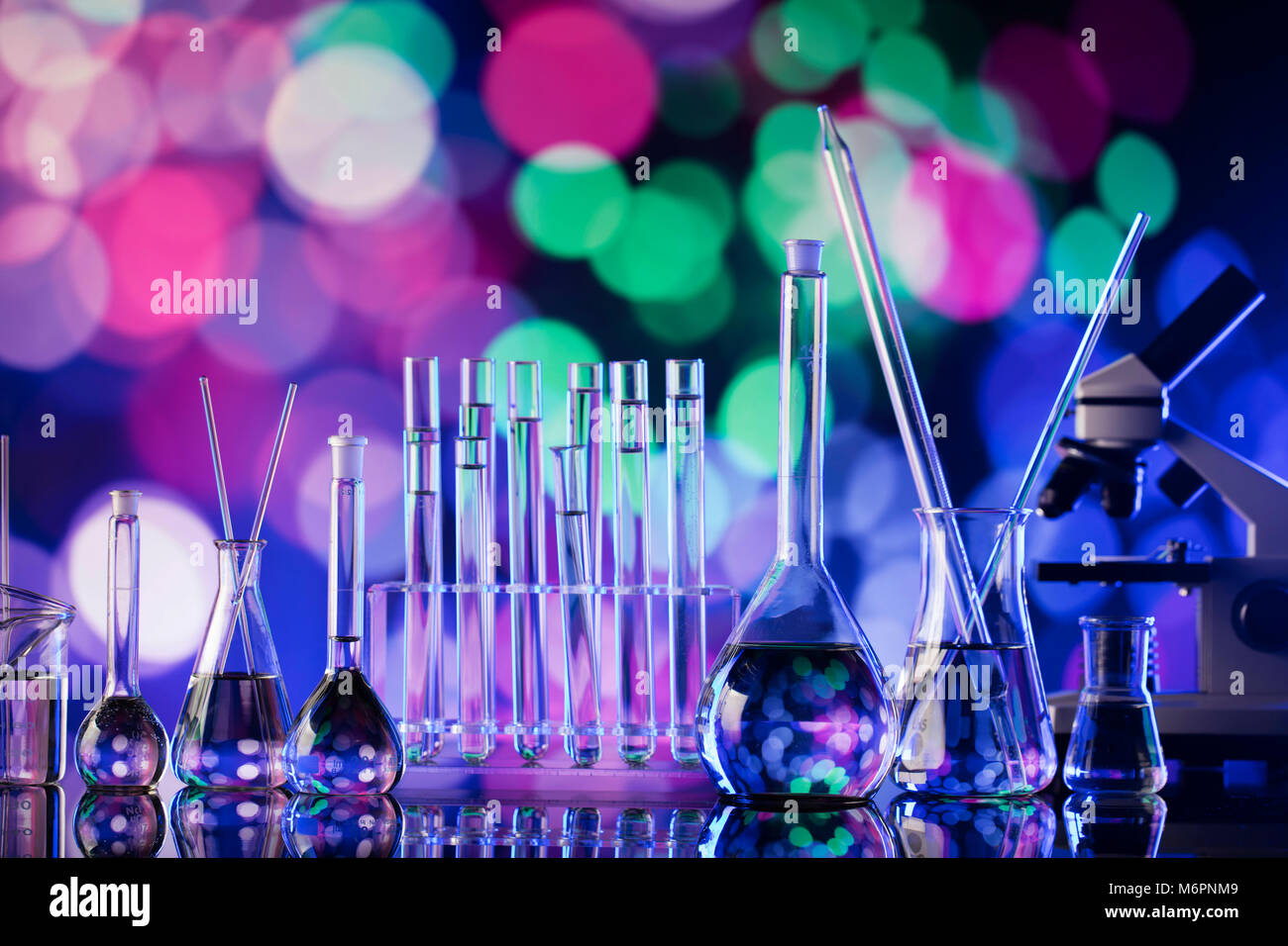 Science concept background. Microscope and laboratory glassware ...